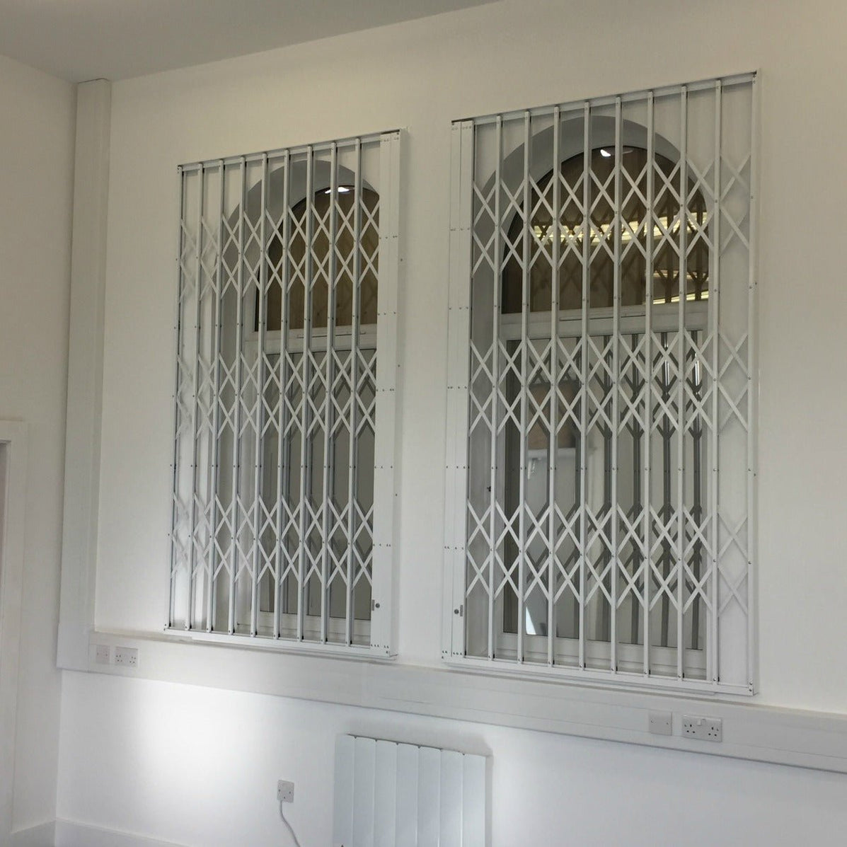 Concertina Retractable Security Grilles — Britannia Retail